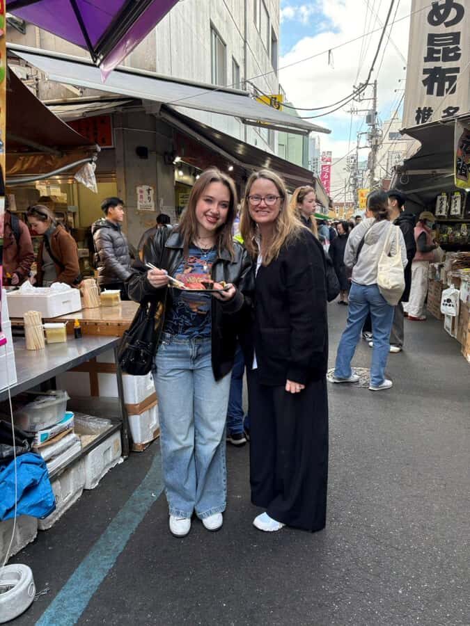 Tokyo: Fish Market Tour with Young Locals (Hotel Pickup) - Visiting Tsukiji Honganji Temple and Learning Customs