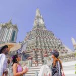 Wat Pho, Wat Arun & Flower Market Walking Tour in Bangkok - Dressing Up: The Thai Royal Attire Experience