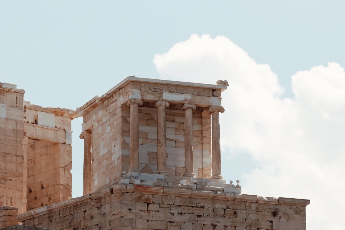 Ancient temple ruins in the Acropolis of Athens under a clear sky