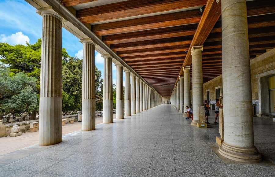 Ancient marble columns displayed inside a museum gallery in Athens