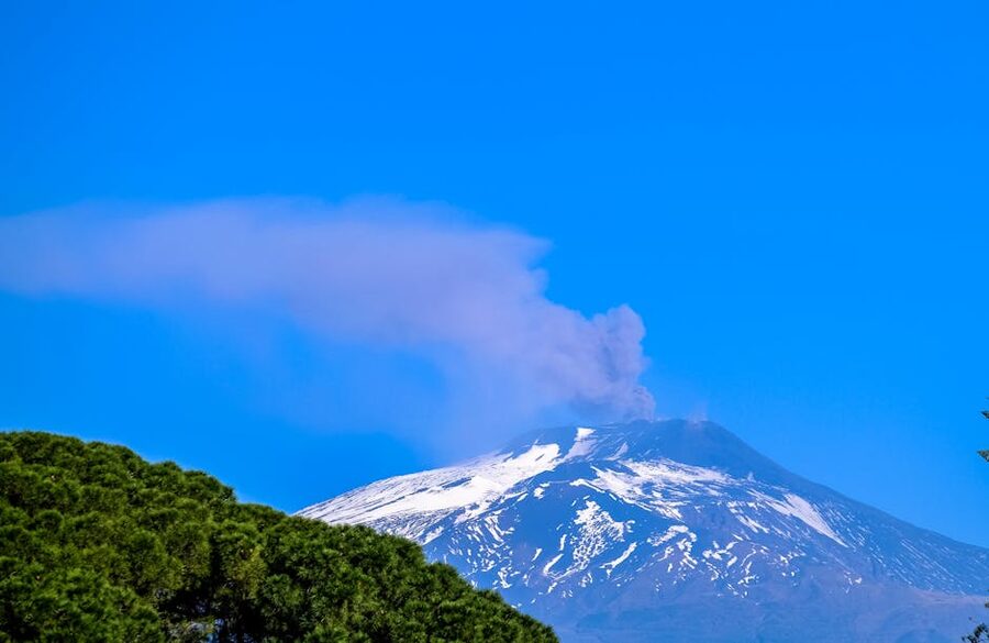 Active volcano with snow and smoke
