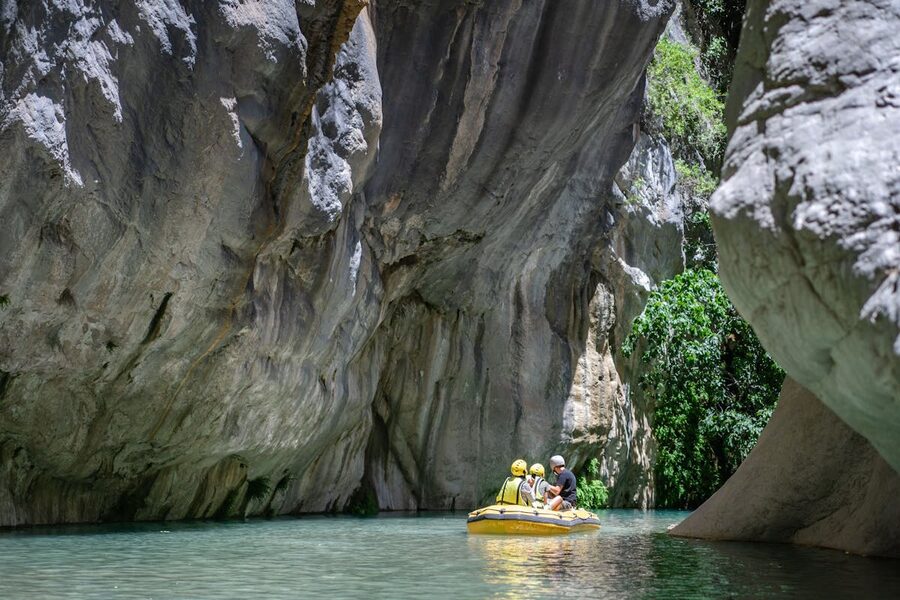 Limestone cliffs rising above turquoise river in a canyon near Antalya