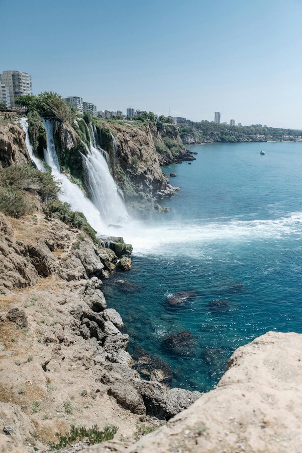 Tourist boats near Duden Waterfall on the Antalya coast