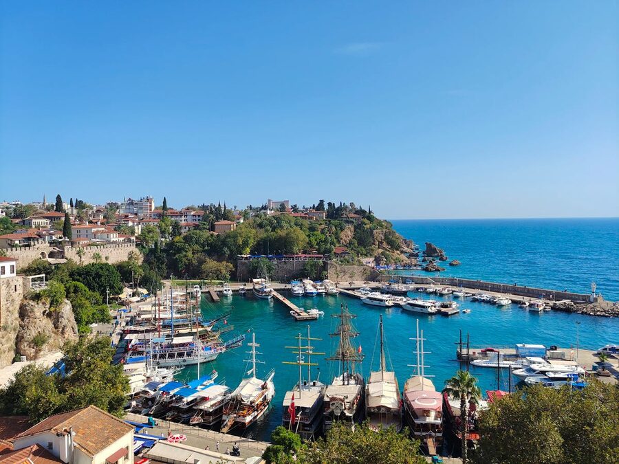 Antalya old harbor with blue water and boats under clear sky