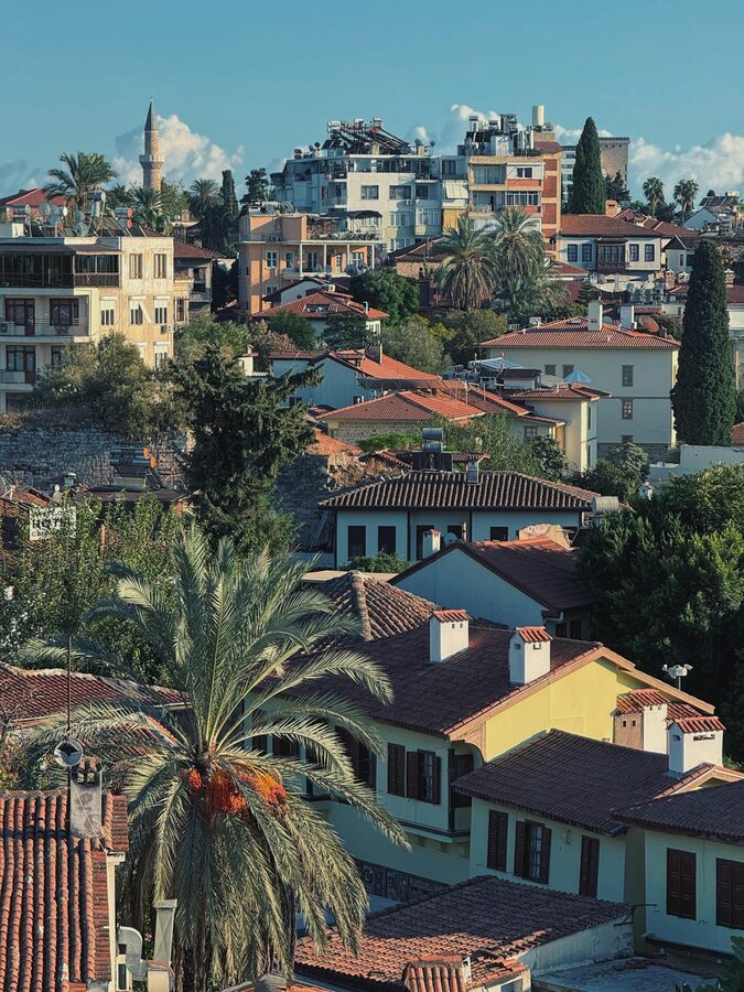 Aerial view of Antalya old town Kaleici with red rooftops and surrounding city