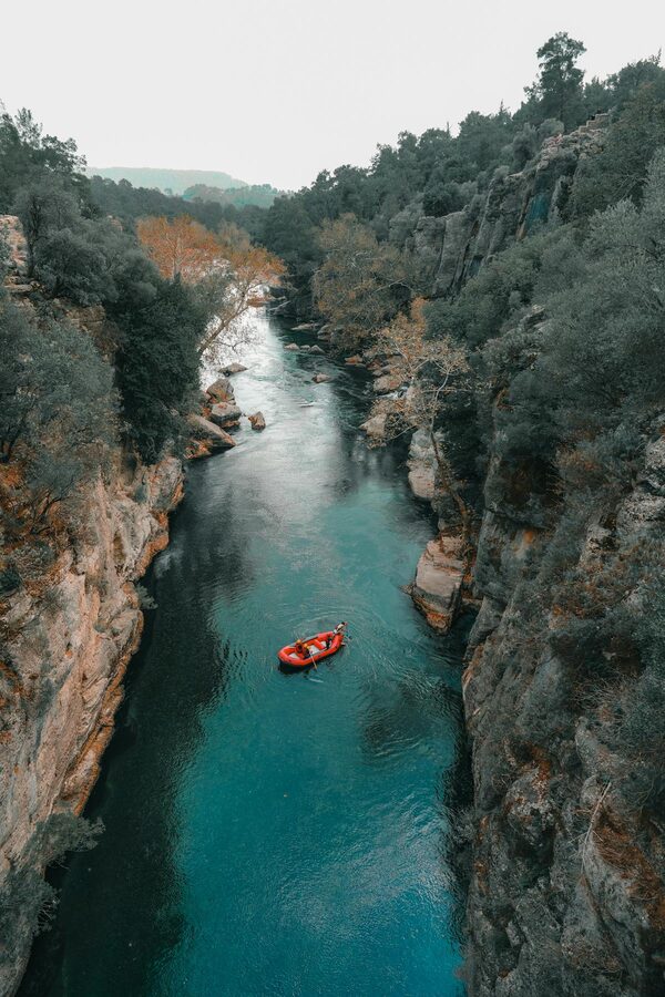 Aerial view of rafting boats on turquoise water in Koprulu Canyon Turkey