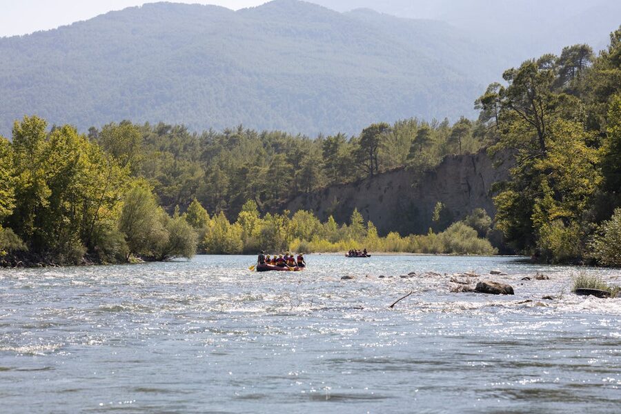 Group whitewater rafting through a river canyon near Antalya Turkey