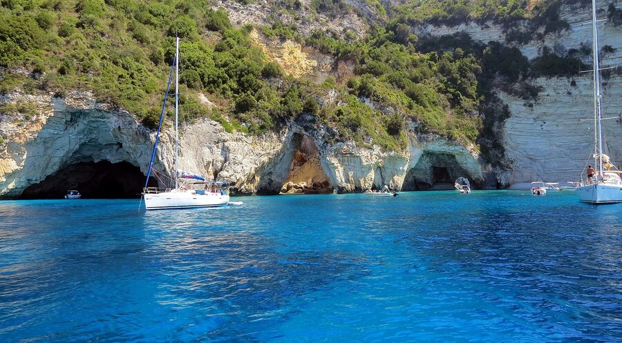 Antipaxos beach with turquoise water and cliffs