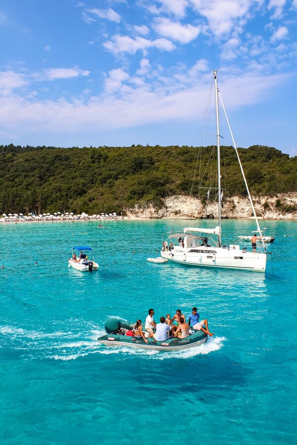 Yacht and swimmers in the turquoise waters off Antipaxos
