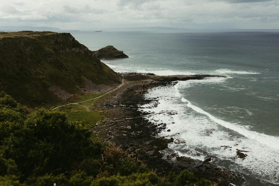 Rugged cliffs along the Antrim coast in Northern Ireland with ocean below