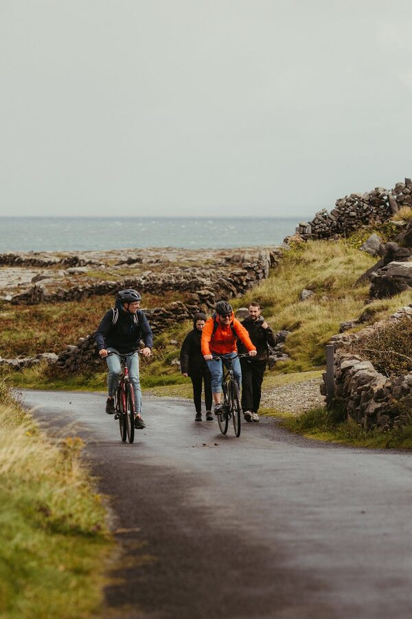 Cyclists riding on the roads of Inishmore near the Aran Sweater Market