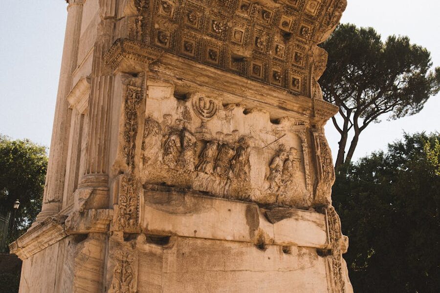 Detailed relief carvings on the Arch of Titus in Rome