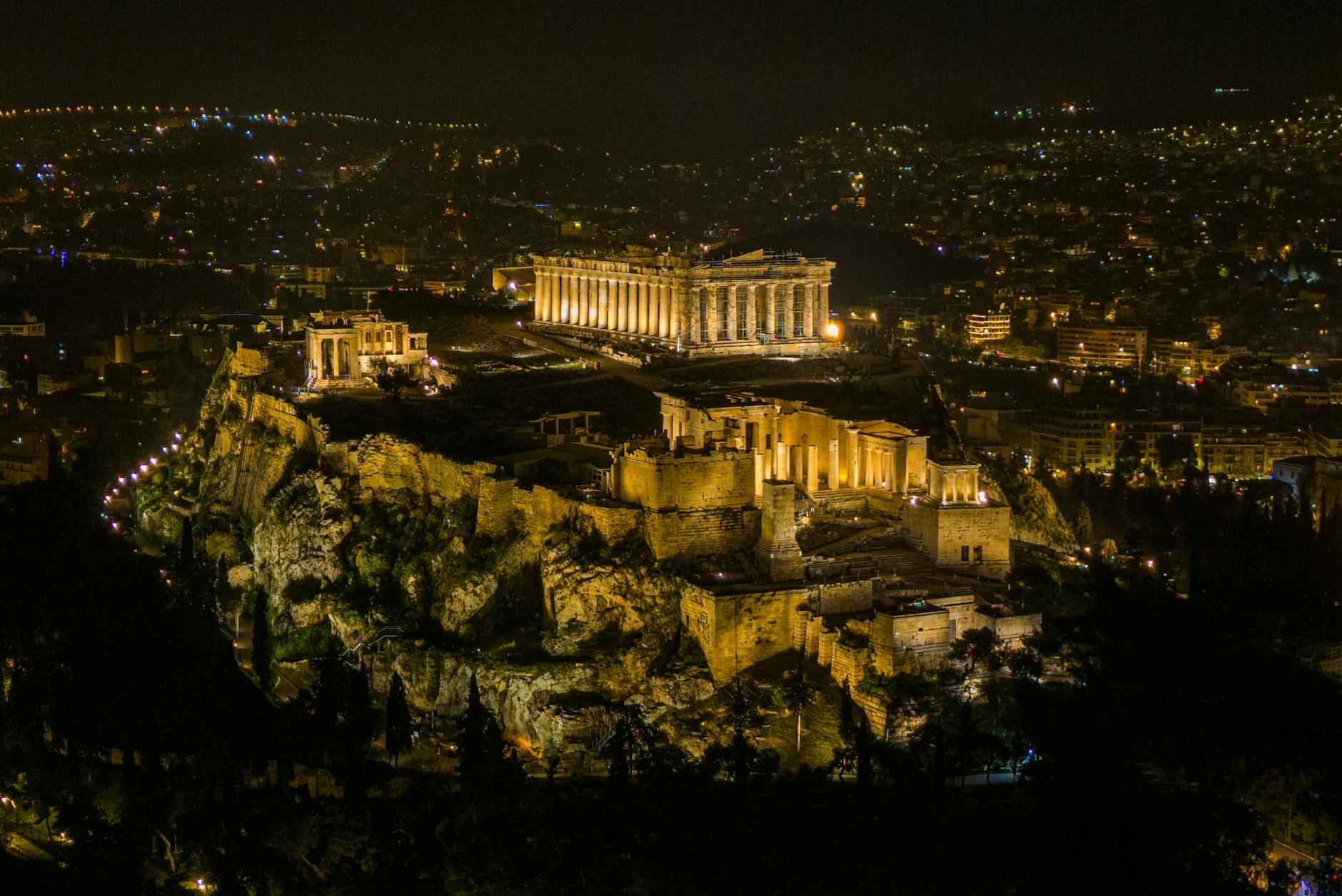 Aerial night view of the illuminated Acropolis in Athens
