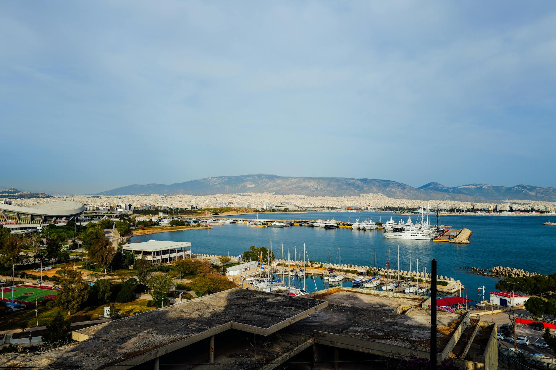 Athens marina with yachts and cityscape
