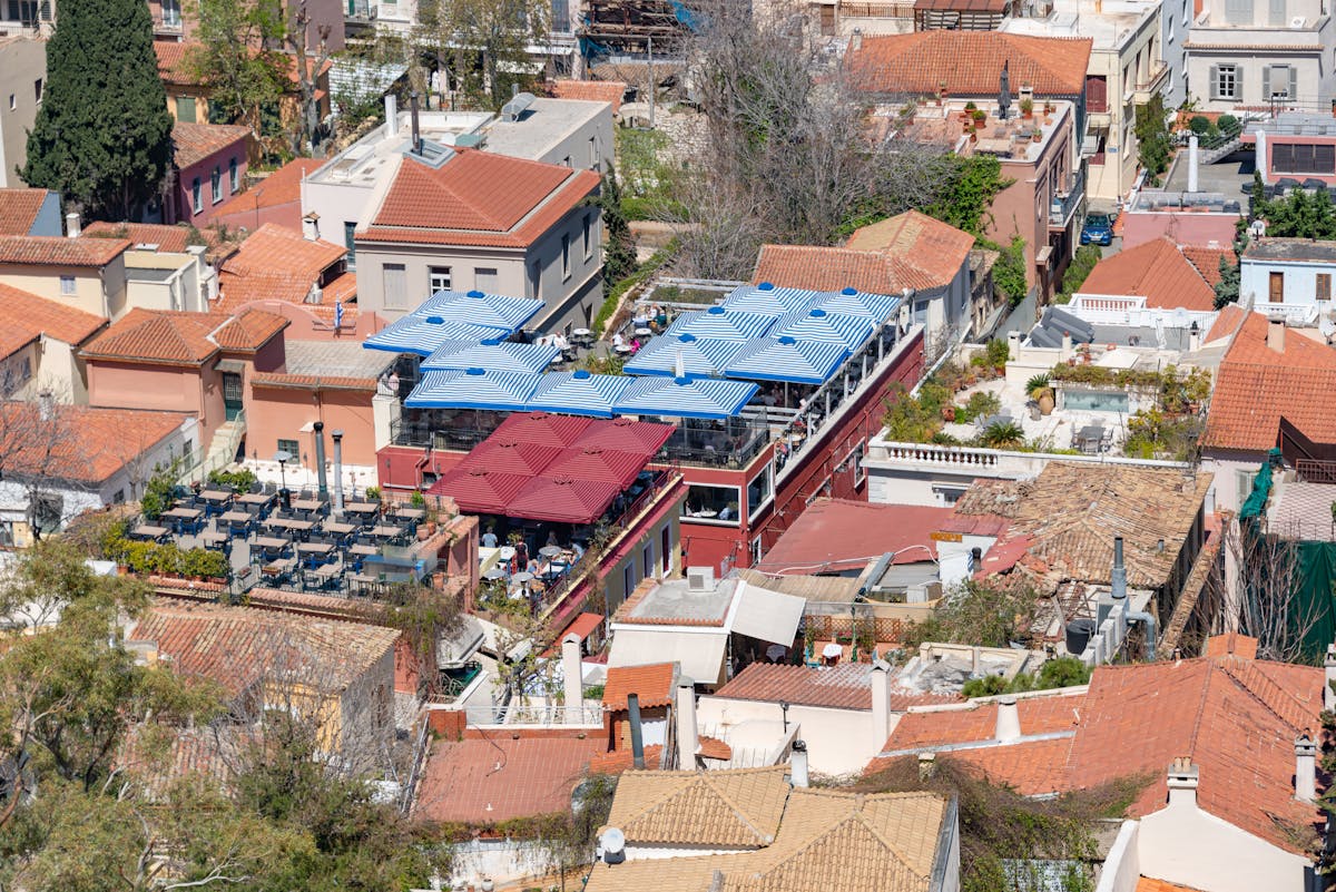 Aerial view of Athens rooftops with colourful taverna umbrellas in the Plaka