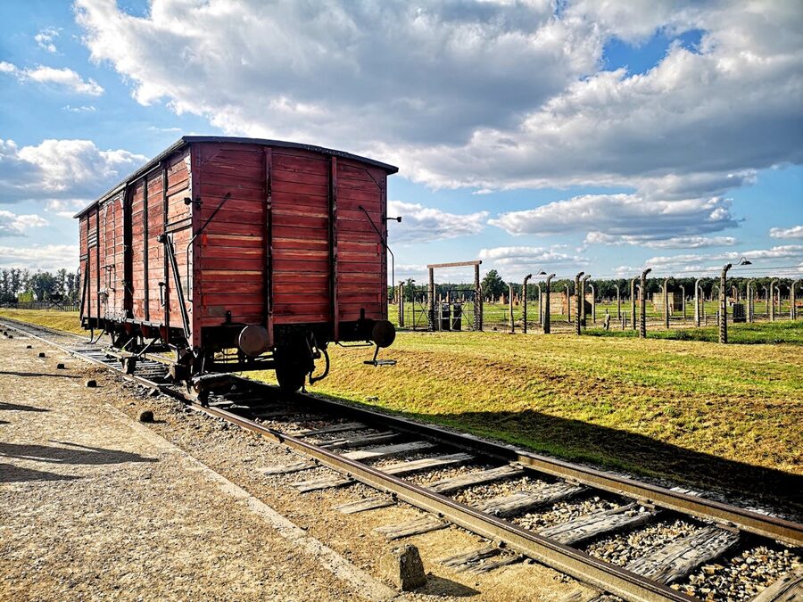 Vintage train car on railway track at Auschwitz-Birkenau