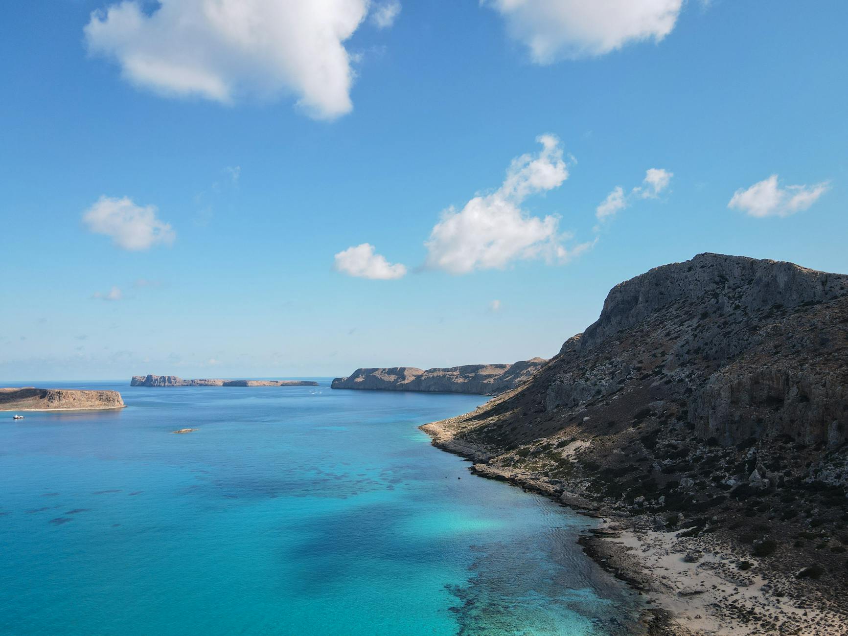 Rocky island in Balos Lagoon turquoise sea