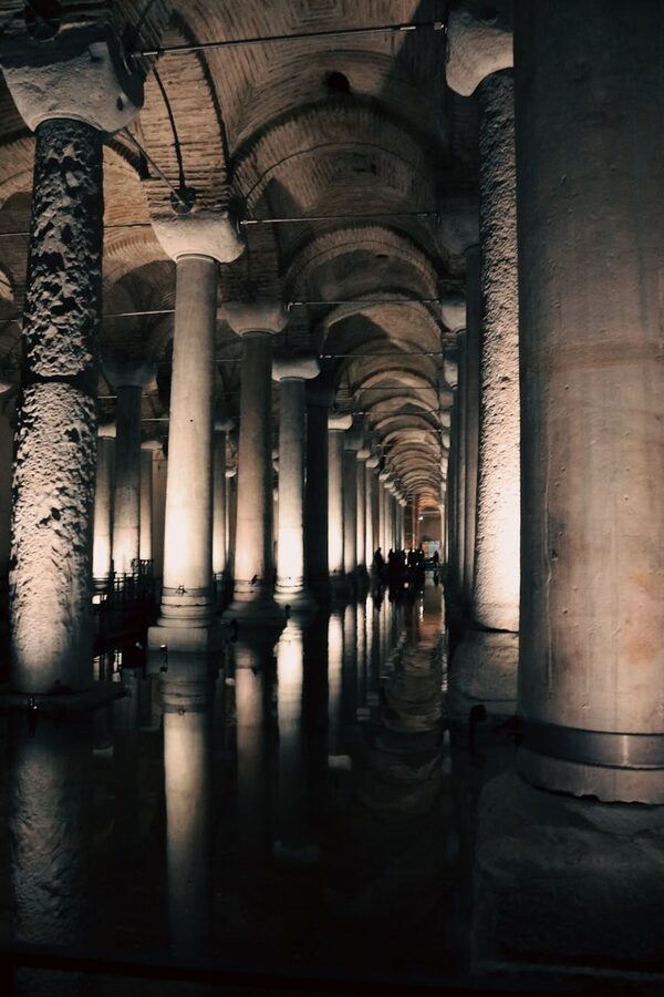 Basilica Cistern columns reflected in water with dramatic night lighting