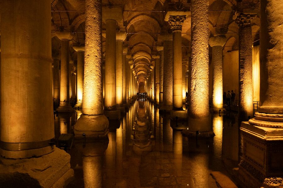 Illuminated walkway and arched ceilings inside the Basilica Cistern