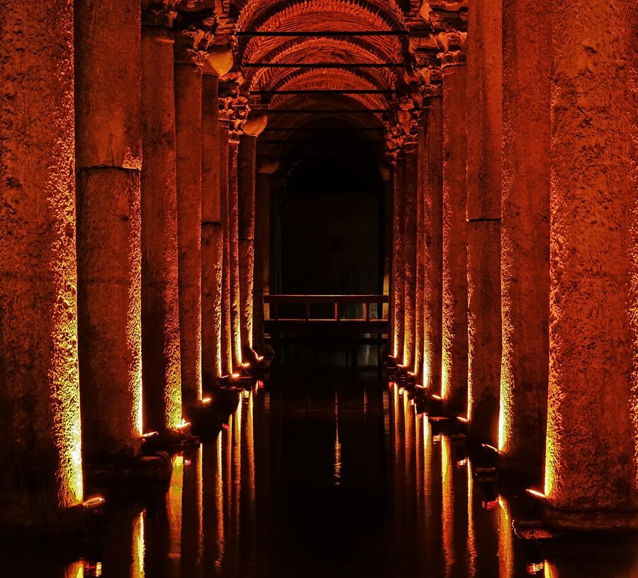 Red atmospheric lighting illuminating columns in the Basilica Cistern