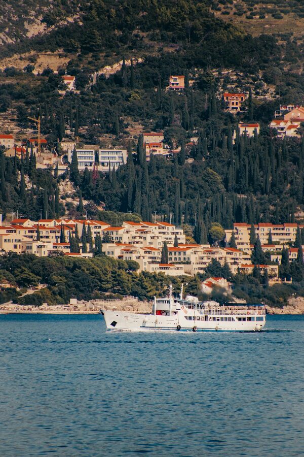 Coastal view of Lopud Croatia with ferry on Adriatic Sea