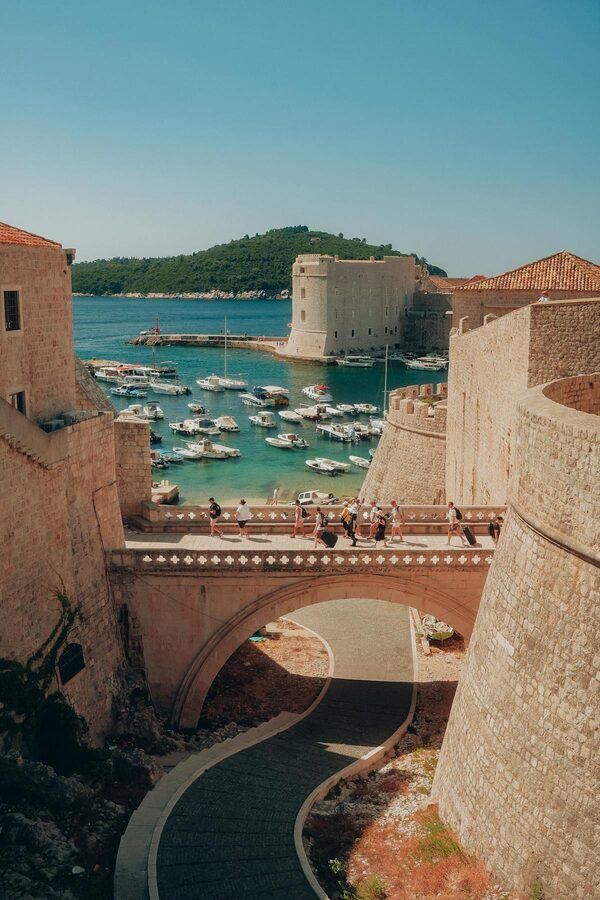 Dubrovnik harbour with medieval walls and blue water