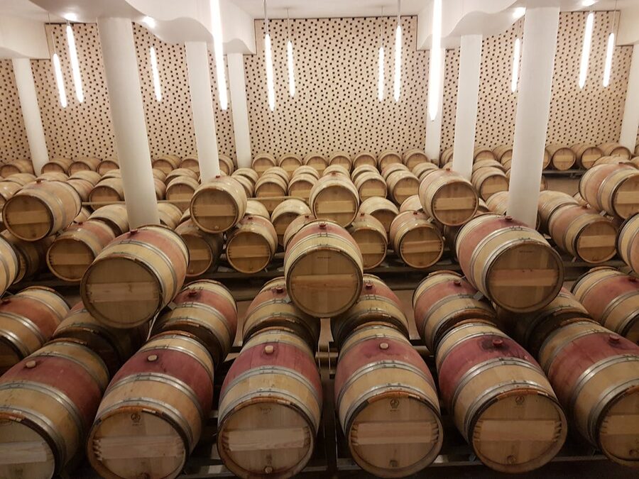 Wine barrels stored in a Saint-Emilion cellar in Bordeaux