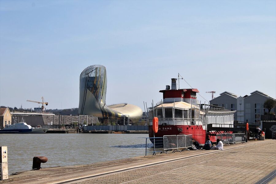 Modern Cité du Vin building and ferry boat at the Bordeaux harbor