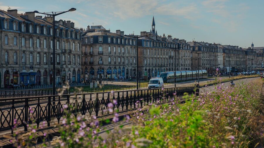 Historic buildings and tram on a street in Bordeaux France