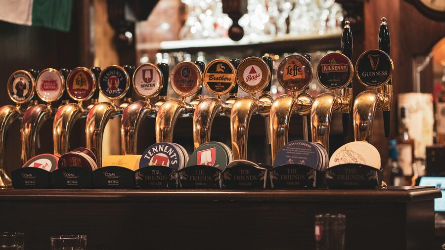 Multiple beer taps including stout and ale in a Dublin bar
