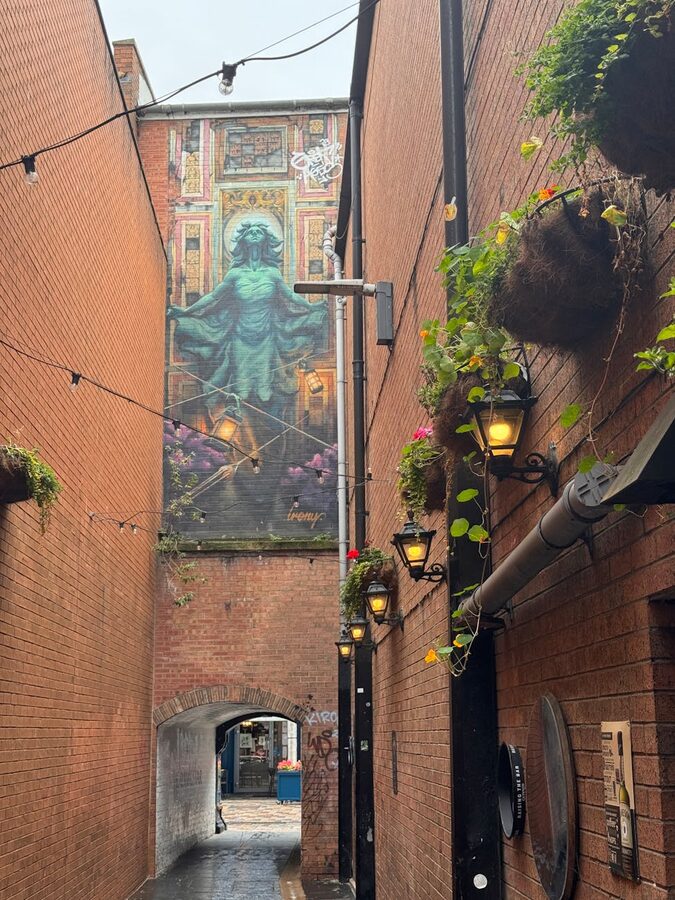 Colourful street mural in a Belfast alleyway