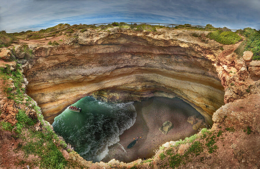 Benagil Cave seen from directly above showing the circular skylight in the roof