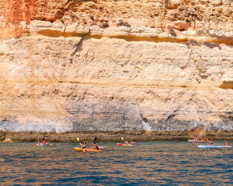 Kayaking along Algarve cliffs at Benagil Portugal
