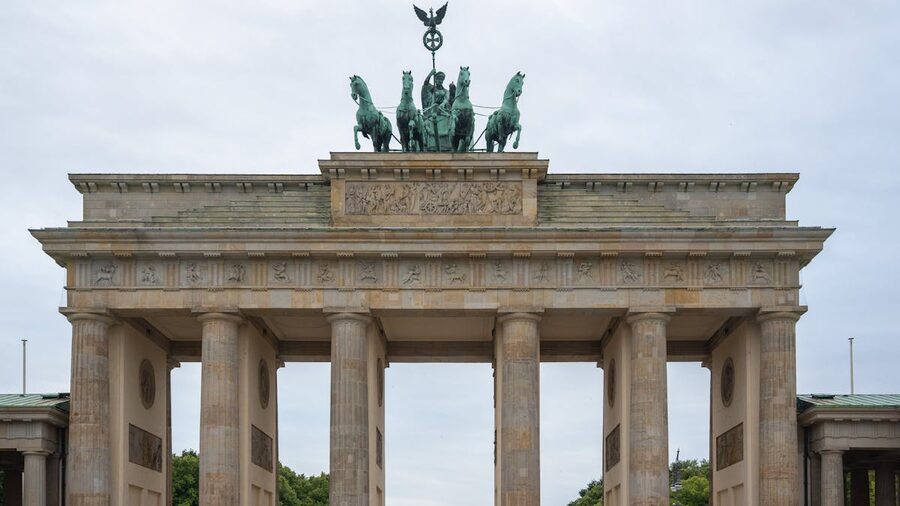 Brandenburg Gate in Berlin on a clear day showing neoclassical columns