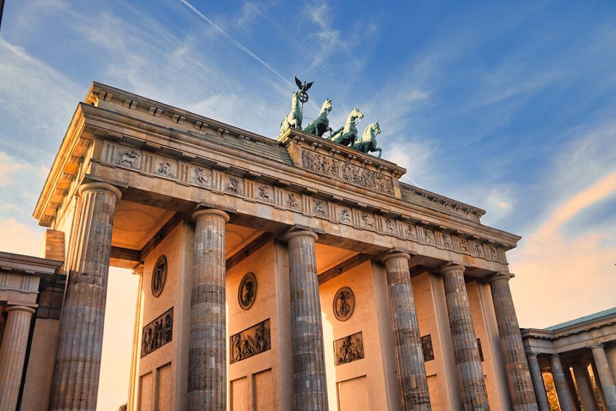 Brandenburg Gate in Berlin at sunset with warm golden light