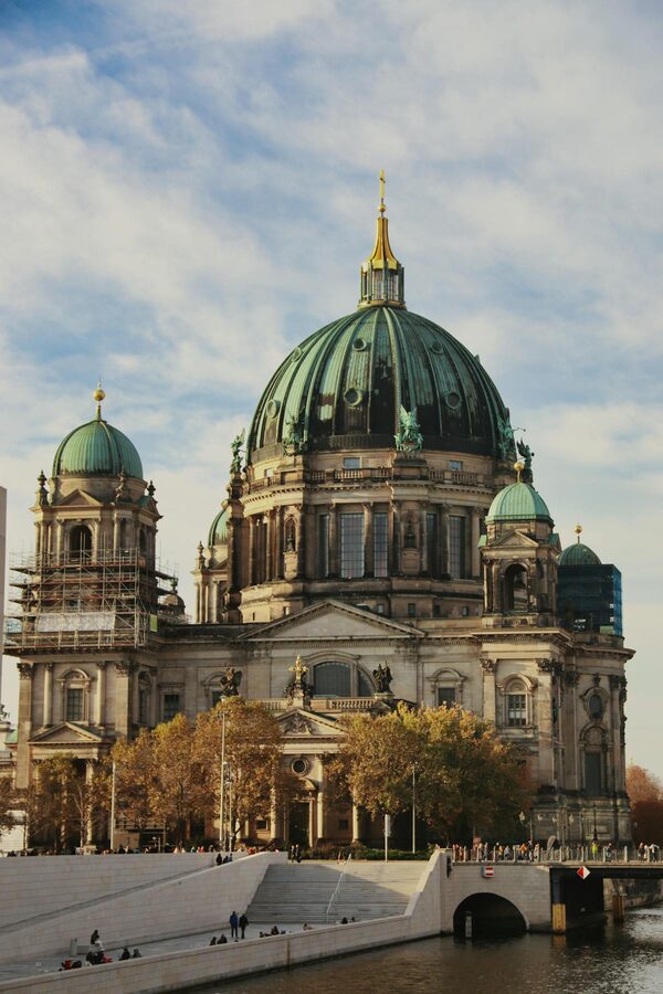Berlin Cathedral beside the Spree River during autumn with colorful foliage