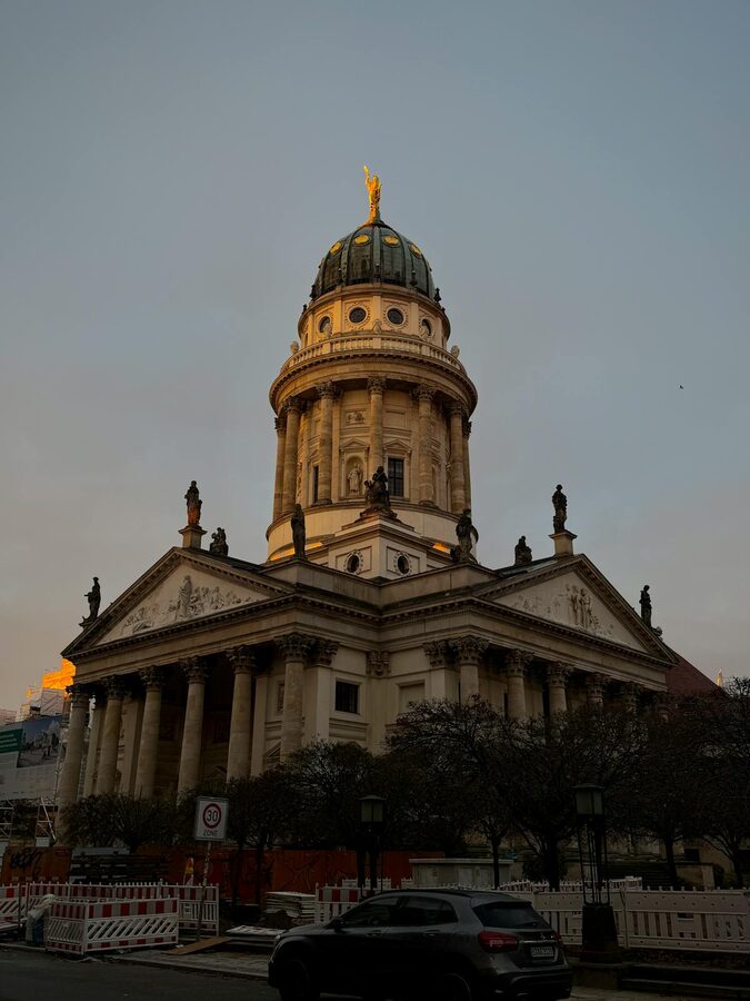 Berlin Cathedral against a dramatic sunset sky