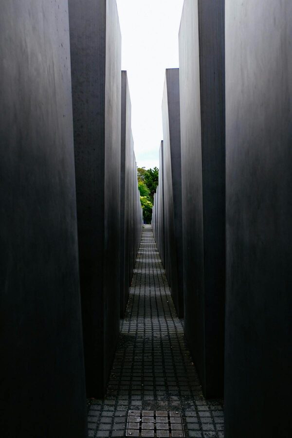 Narrow pathways between tall concrete blocks at the Berlin Holocaust Memorial