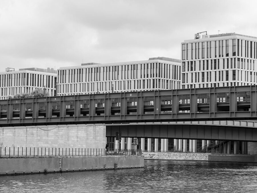 Black and white photo of modern architecture over the river in Berlin