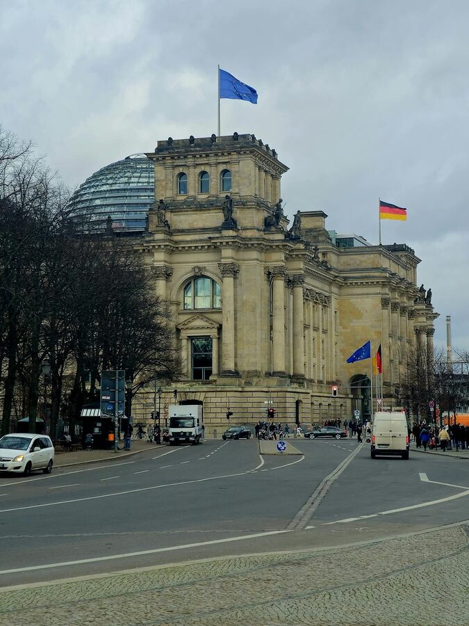 Reichstag Building in Berlin with German and EU flags flying