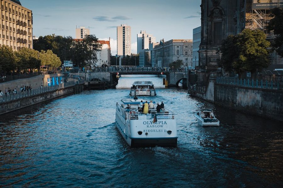 Canal in Berlin with boats and modern architecture