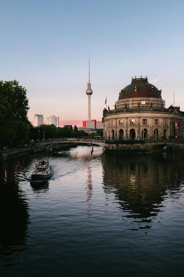 Bode Museum and Berlin TV Tower across the Spree River at sunset