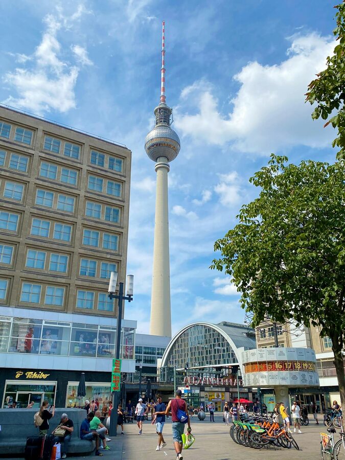 Berlin TV Tower and Alexanderplatz under bright blue sky