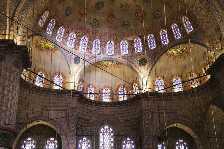 Blue Mosque dome with stained glass windows illuminating the interior