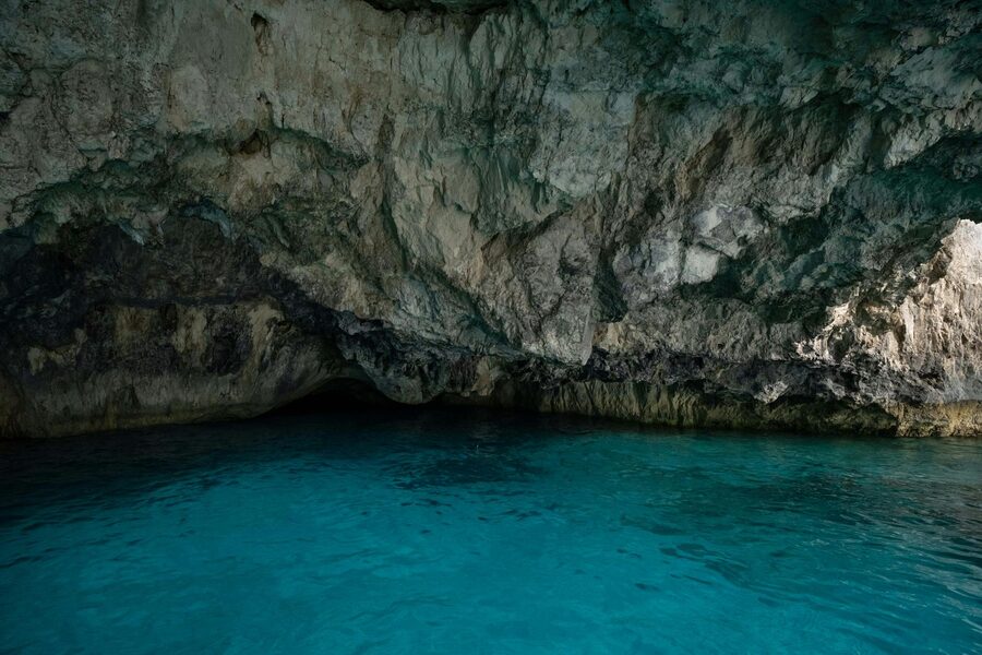 Inside a natural sea cave with blue light