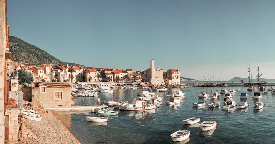 Boats near stone buildings on Croatian coast