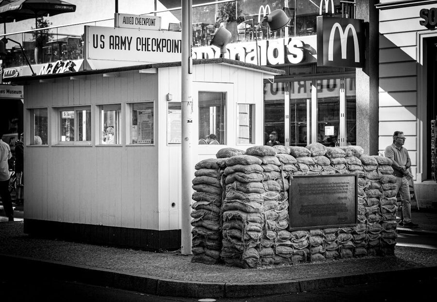Black and white photograph of Checkpoint Charlie in Berlin