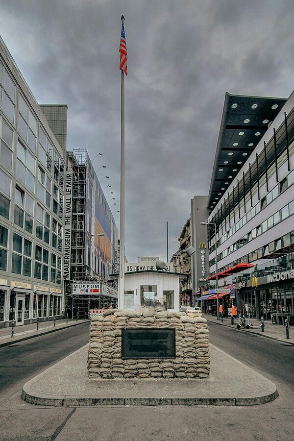 View of Checkpoint Charlie showing the historic crossing point and surrounding modern Berlin