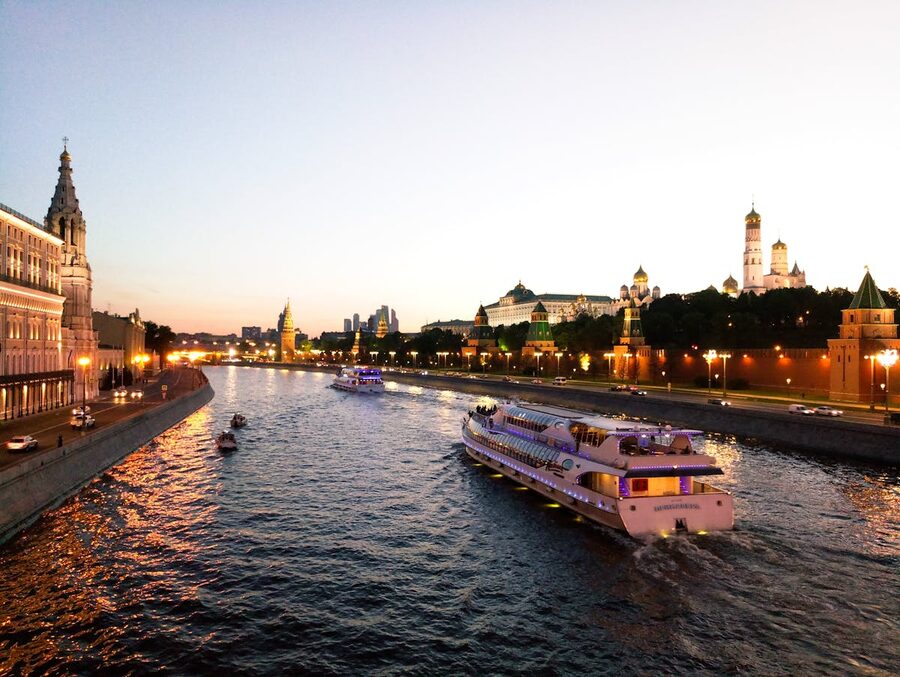 City lights reflected on river at night