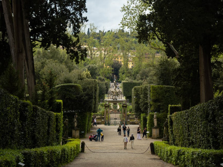 Visitors leisurely walking through Boboli Gardens